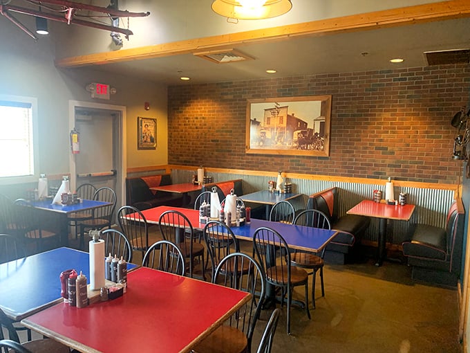 Primary-colored tables pop against the rustic backdrop &ndash; a dining room that says "we're casual, but we take our barbecue seriously."