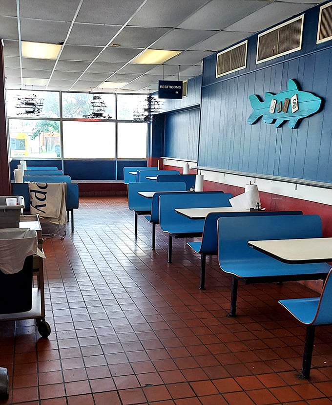 Blue booths that have cradled countless happy diners, under the watchful eye of Joe's signature fish sign.