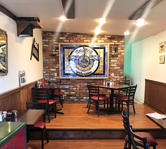 That stained glass stove emblem against exposed brick isn't just decoration&mdash;it's a shrine to the breakfast arts that keeps Californians making the mountain pilgrimage.
