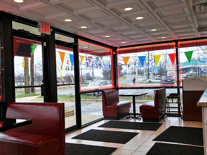 The dining area welcomes guests with comfortable seating and cheerful bunting, proving good chicken deserves a proper setting for enjoyment.