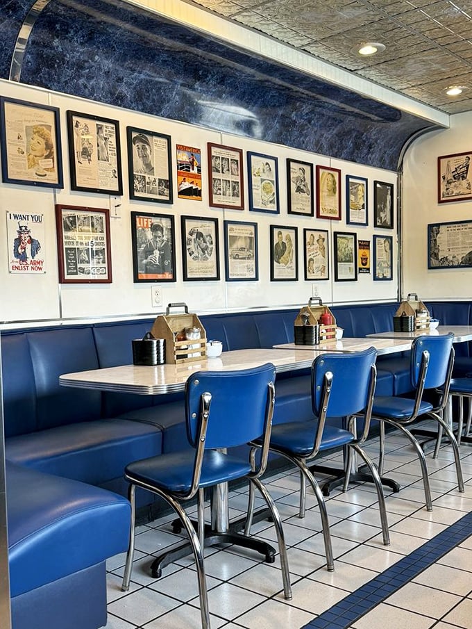 Blue vinyl booths and vintage advertisements create the perfect backdrop for morning conversations and coffee refills that never seem to end.