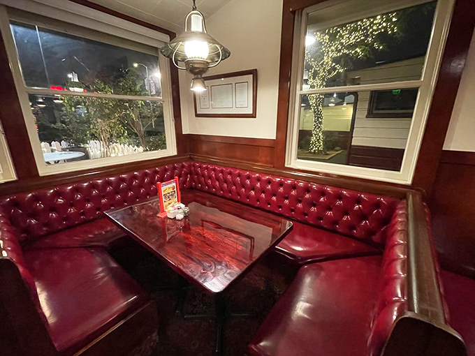 These corner booths have heard more secrets, business deals, and first date conversations than most therapists. The red vinyl keeps your confidences.