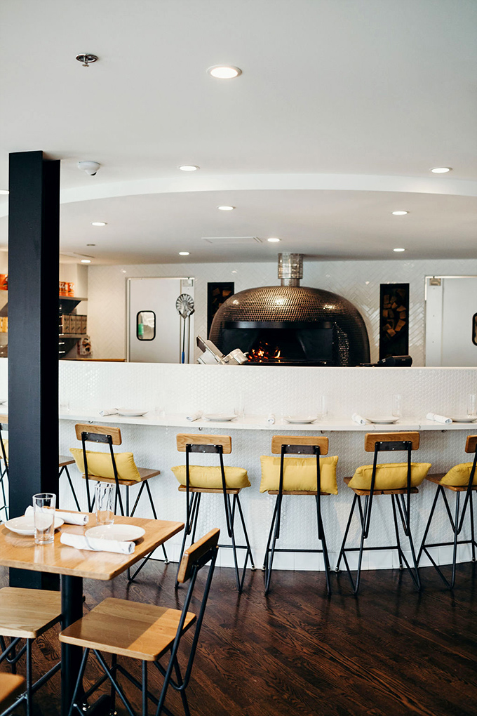 Front-row seats to culinary theater&mdash;watching pizzas transform in that gleaming dome oven is better than anything on Netflix.