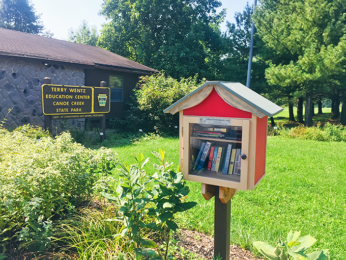 Knowledge and nature, perfect neighbors. The Terry Wentz Education Center welcomes curious minds while that adorable little library begs you to borrow a book.