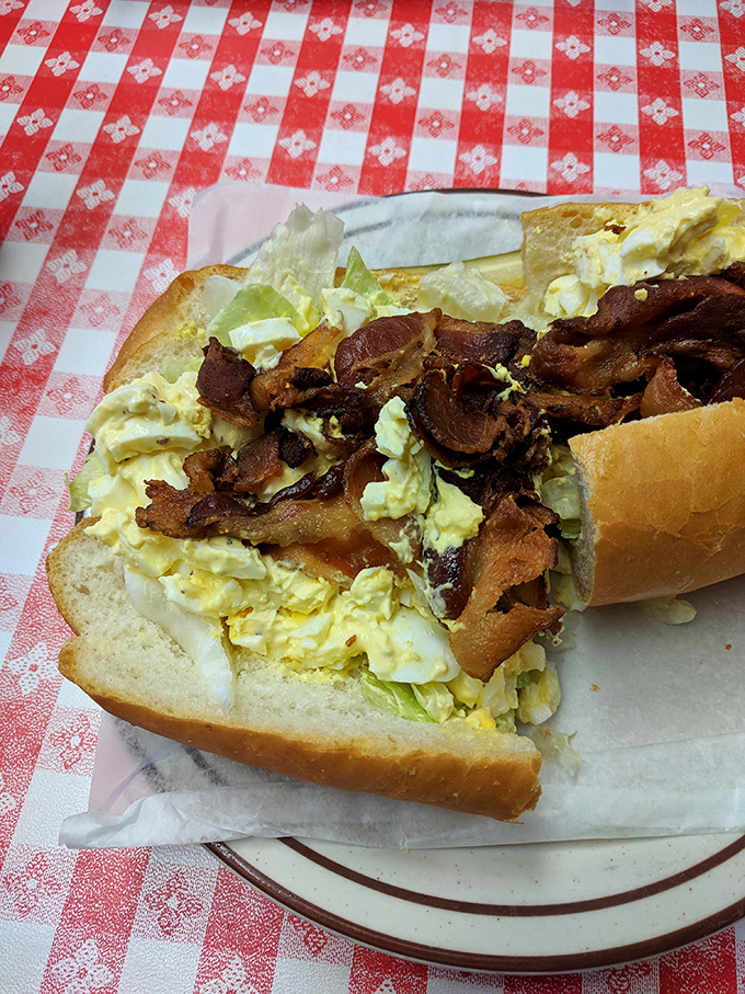 Egg salad and bacon &ndash; breakfast and lunch having a delicious reunion party on bread. The mayo brings everyone together like a culinary peacemaker. 