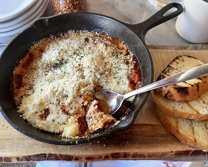 Bubbling cheese in a cast-iron skillet, the kind of dish that makes you want to cancel your plans and commit to a serious relationship with carbs.