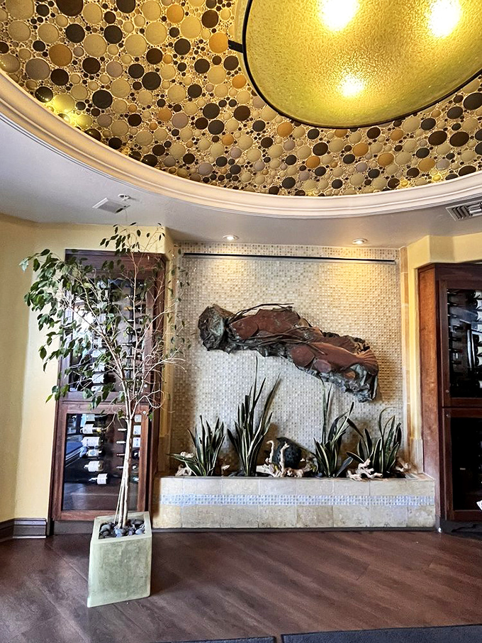 The ceiling's bubble design creates a champagne-like effervescence overhead, setting the mood before you've even ordered your first drink.