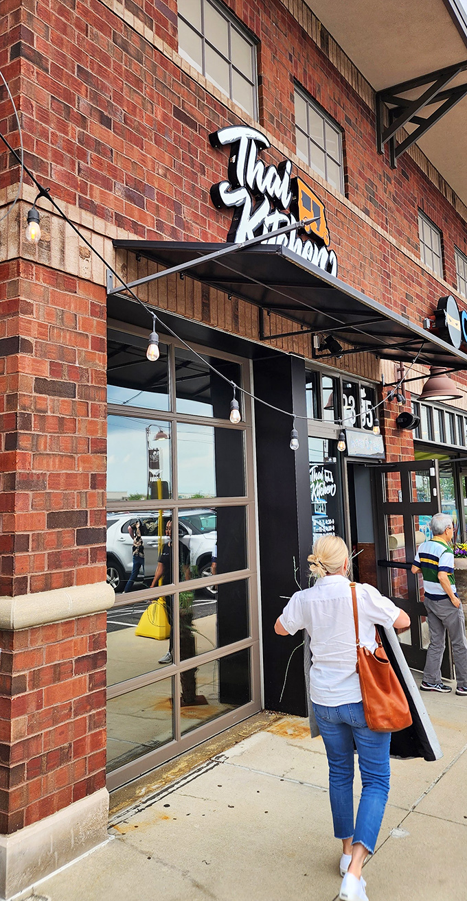 The entrance to your next favorite restaurant, disguised as just another strip mall doorway.