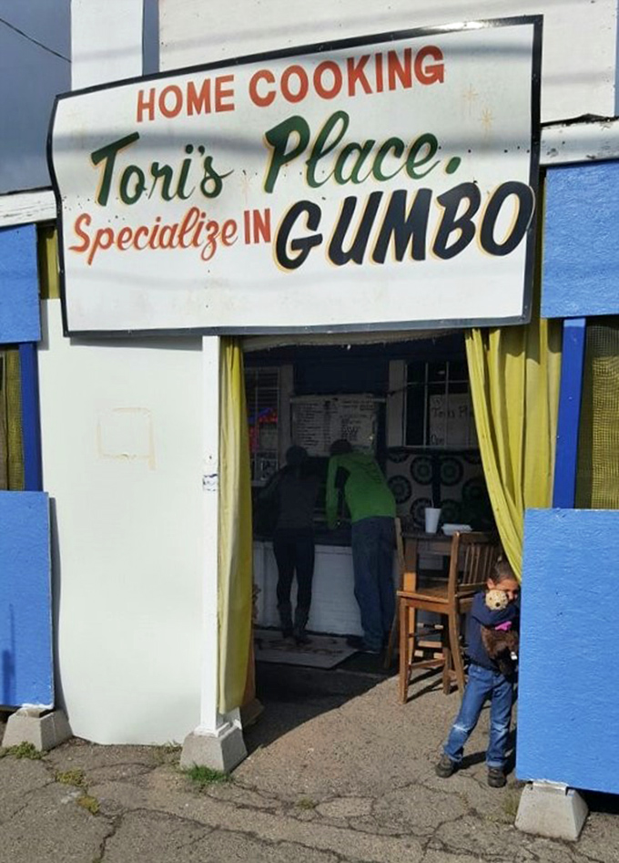 The simple entrance to Tori's Place, where "Home Cooking" and "Specialize in Gumbo" says it all perfectly.