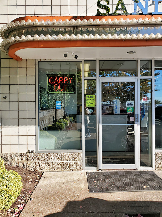 The "Carry Out" sign glows with promise—yes, you can take this comfort home, but something special happens when you eat it right here.