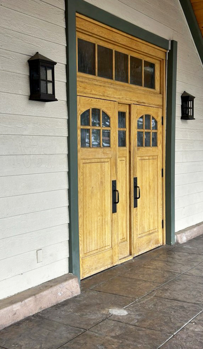 These wooden doors don't just lead to a restaurant; they're a portal to comfort food paradise that feels like coming home.