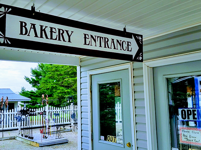 The "Bakery Entrance" sign might as well say "Abandon All Diets, Ye Who Enter Here" &ndash; a portal to delicious temptation.