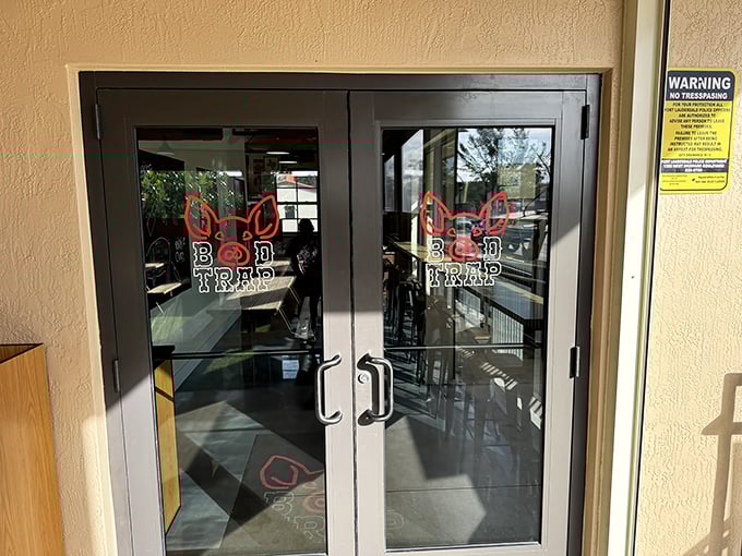Glass doors welcome hungry visitors into a world where authentic barbecue meets contemporary dining style.