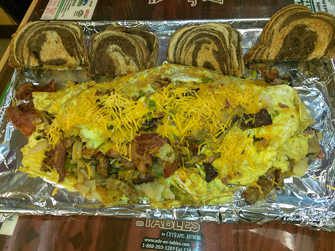 The Farmer's Omelet Challenge isn't just breakfast&mdash;it's an edible monument to excess, complete with enough cheese to make Wisconsin proud.