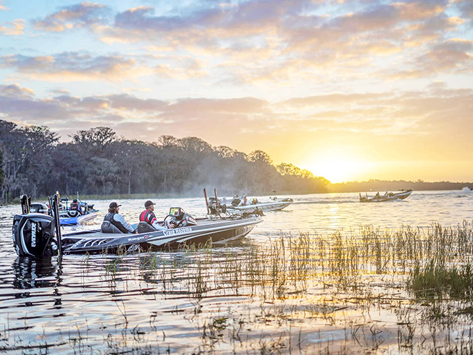 Dawn breaks over the lake as fishing boats slip into position. These early risers know secrets about Leesburg waters that sleeping tourists will never learn.