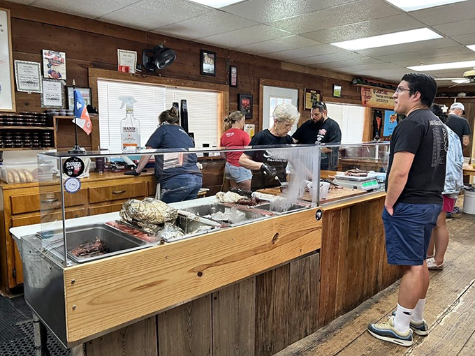 The serving line – where dreams come true one slice at a time, and decisions become increasingly difficult with each passing second.