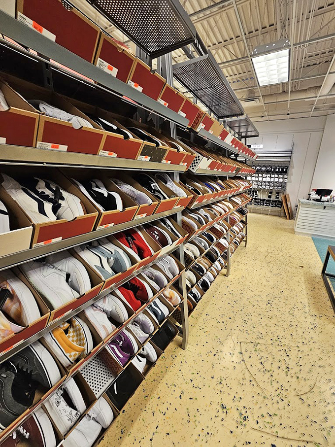 Sneaker heaven stretches before you in organized chaos. The Nike outlet offers more athletic footwear options than you have activities to wear them for.