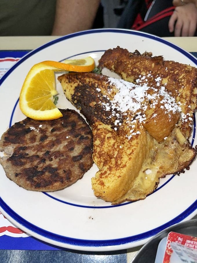French toast that's dressed for success, dusted with powdered sugar like a light Baltimore snowfall. Breakfast that eats like dessert.