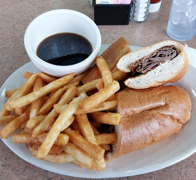 The French dip sandwich that makes you wonder why you'd ever order anything else, with fries standing at attention like crispy soldiers.
