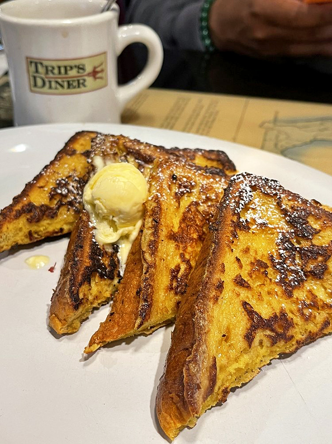 French toast that's achieved the perfect golden-brown tan that Floridians spend hours on the beach trying to match, topped with a melting pat of butter.