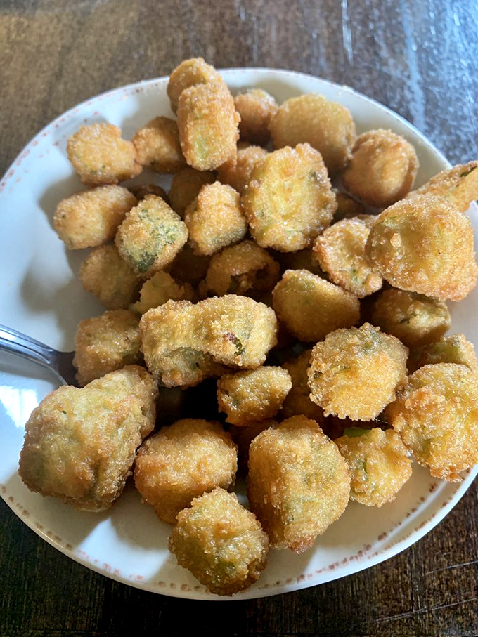 Fried okra that converts even the most stubborn skeptics. These golden nuggets are the South's answer to popcorn.