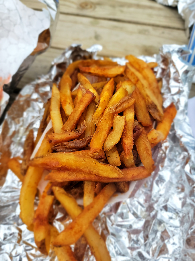 Golden, hand-cut fries that crackle with seasoning. The perfect sidekick to the main attraction&mdash;crispy outside, fluffy inside, and utterly irresistible.