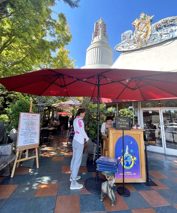 The host stand, guarded by that iconic blue logo, is where dreams of Famous French Toast begin and weekend wait times are announced.