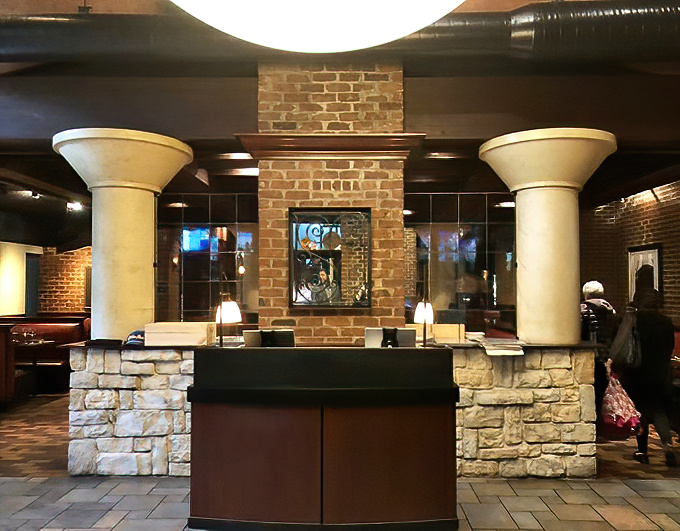 Stone columns and brick walls frame the entrance to culinary adventures&mdash;like the gateway to a delicious dimension.