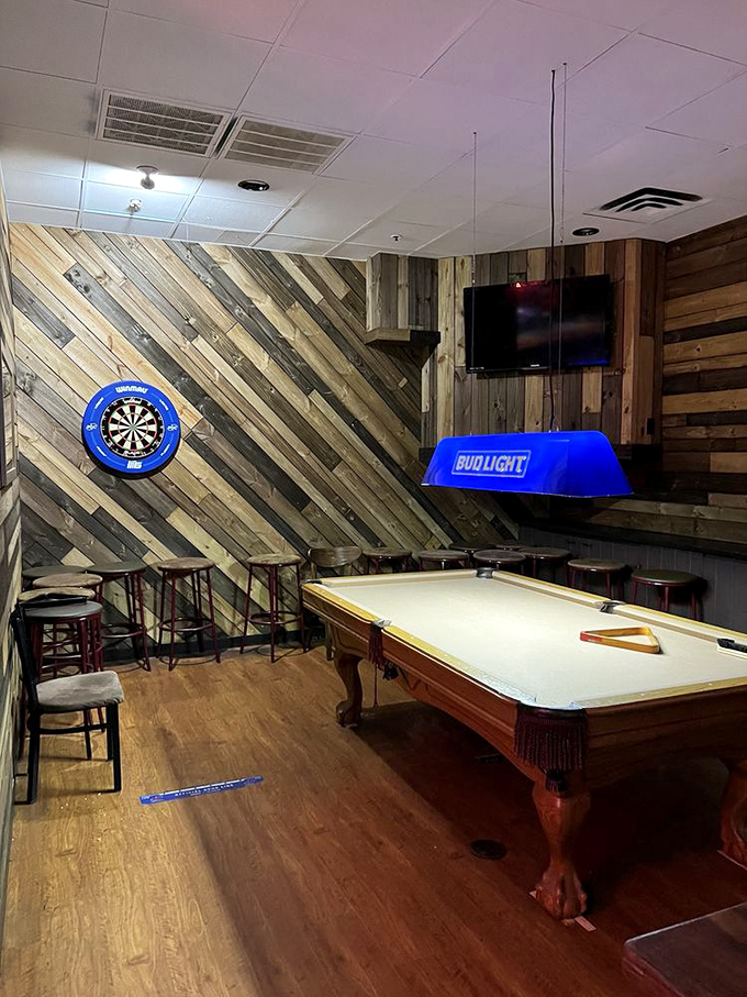 The dart board and pool table corner&mdash;where friendly competitions begin and diet resolutions end.