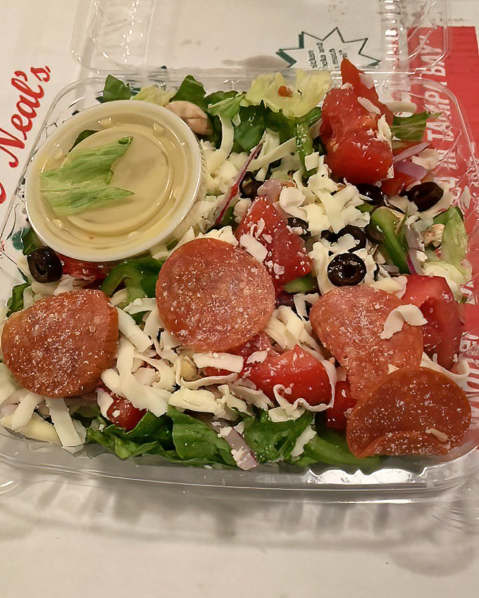 Even their to-go salads look like they're dressed for success&mdash;pepperoni confetti included.