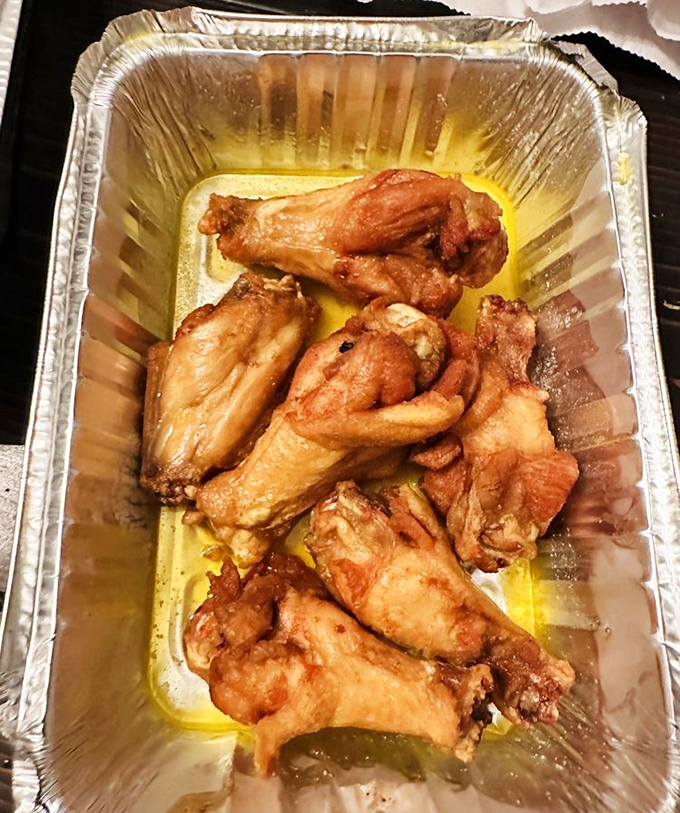 These wings aren't trying to win awards with exotic flavors&mdash;they're just perfectly crispy, swimming in garlic butter, and absolutely irresistible.