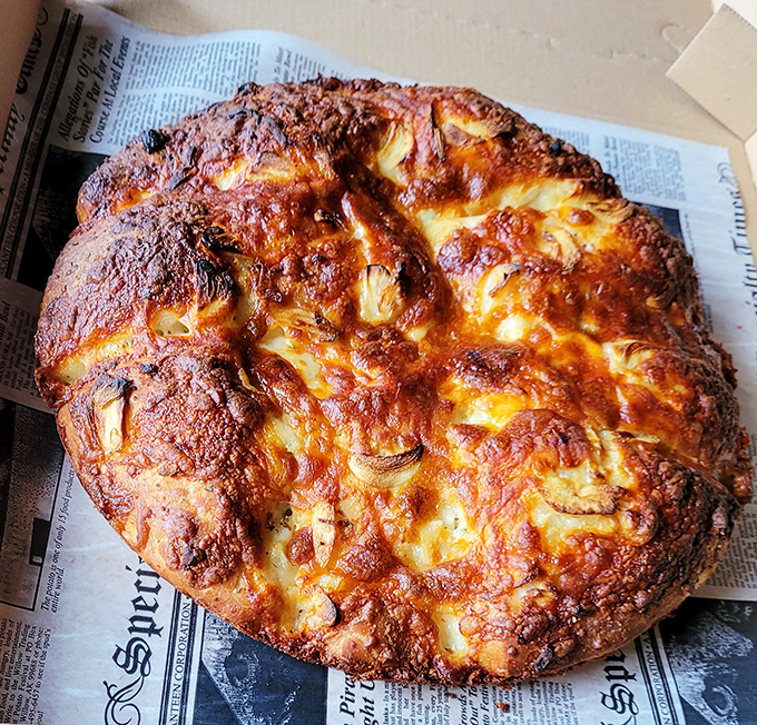 This isn't just any garlic knot&mdash;it's a golden-brown flavor bomb that puts ordinary breadsticks to shame. Carb heaven exists, and we've found it.