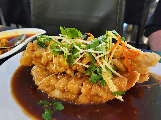 This golden-fried fish, garnished with fresh herbs, is the Beyonc&eacute; of the buffet &ndash; it knows it's fabulous.
