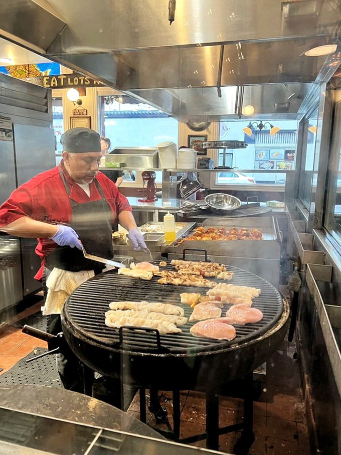 Where the magic happens: watching your seafood transform from ocean treasure to plate perfection on the open grill.
