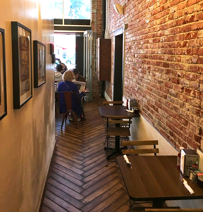 The herringbone wood floors lead you down a hallway of anticipation. Brick walls have absorbed decades of satisfied sighs and coffee-fueled conversations.
