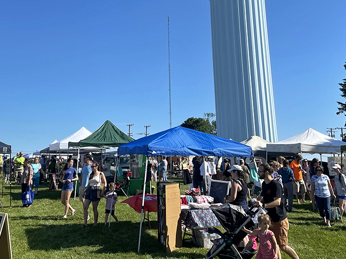 The Hampstead Farmers' Market transforms an ordinary field into a bustling community celebration where the town water tower stands sentinel.