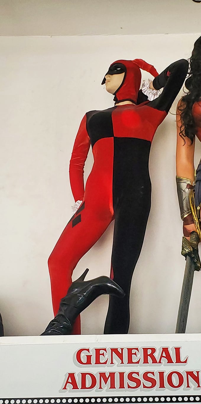 Harley Quinn strikes a pose that says, "I'm dangerous, unpredictable, and possibly experiencing a leg cramp from standing like this for decades."