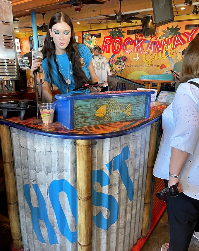 The host stand welcomes you to paradise with bamboo accents and a smile that says, "Yes, we do have a table with a view."