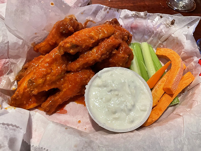 Hot garlic wings with cooling dip and fresh veggies &ndash; nature's perfect balance. The kind of wings that haunt your dreams in the best way.