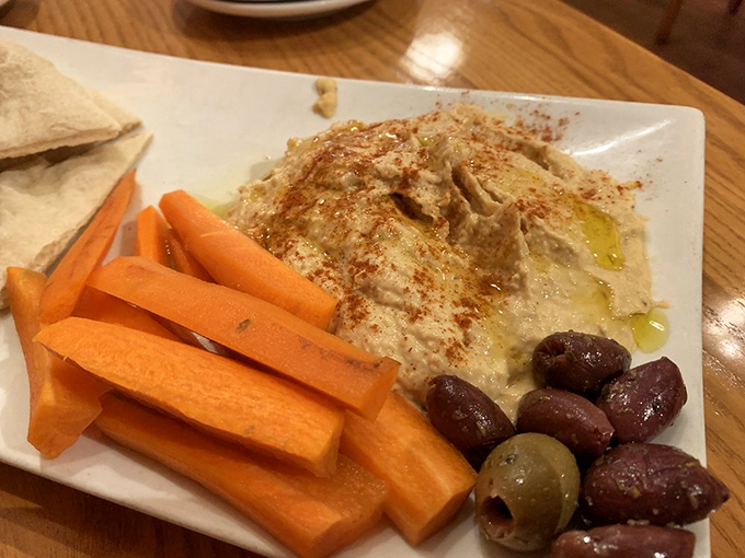 Hummus that's traveled far from its Middle Eastern roots to find happiness in Ohio, accompanied by its vegetable entourage.