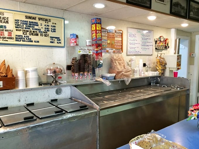 The ice cream counter stands ready for battle on a summer afternoon. Those steel containers have witnessed more joy than most therapists.