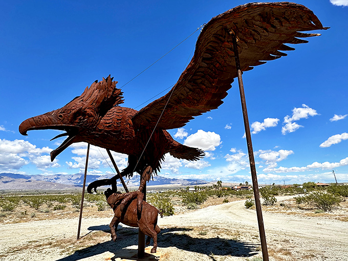 Majestic wingspan meets desert imagination in this dramatic eagle sculpture that seems ready to soar despite its iron bones.