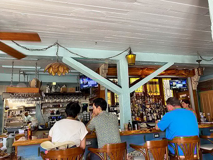 The indoor bar's exposed beams and nautical touches create that perfect dive-bar-meets-tropical-paradise vibe that defines authentic Key West dining.