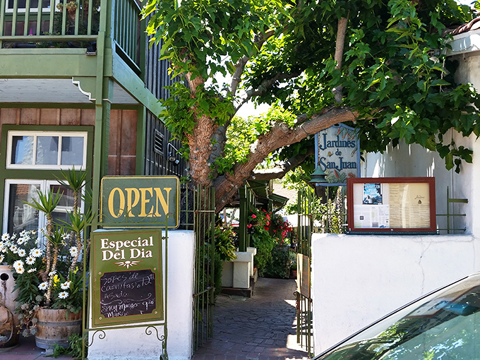 Jardines De San Juan beckons with leafy promise. That "Open" sign might as well say "Paradise Found."