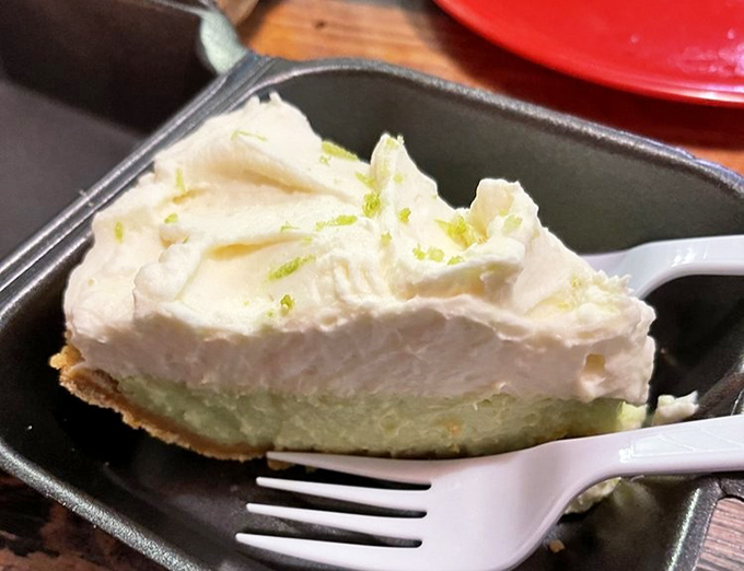 This key lime pie doesn't just end your meal; it hits the refresh button on your taste buds with a creamy, citrusy finale to all that smoky richness.