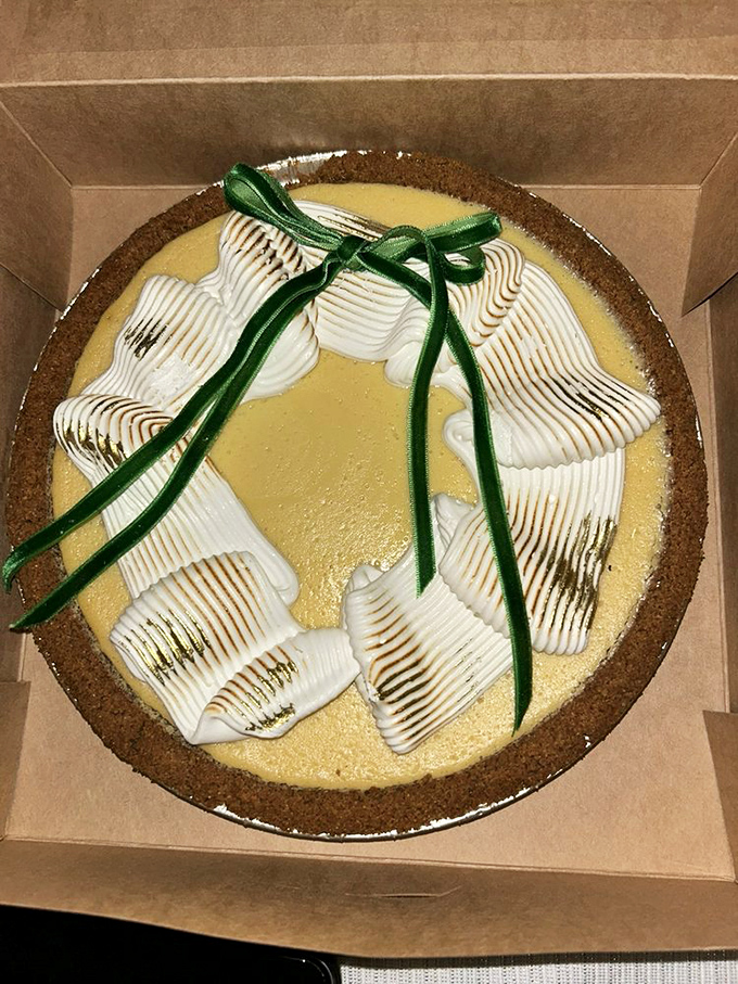 Key lime pie with a green ribbon that says "I'm fancy, but I'll still make your mouth pucker with Florida citrus attitude."