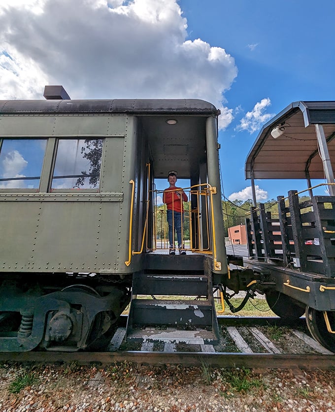 Every child's dream realized: standing at the threshold of adventure, one foot in the present, one in a world of railway imagination.