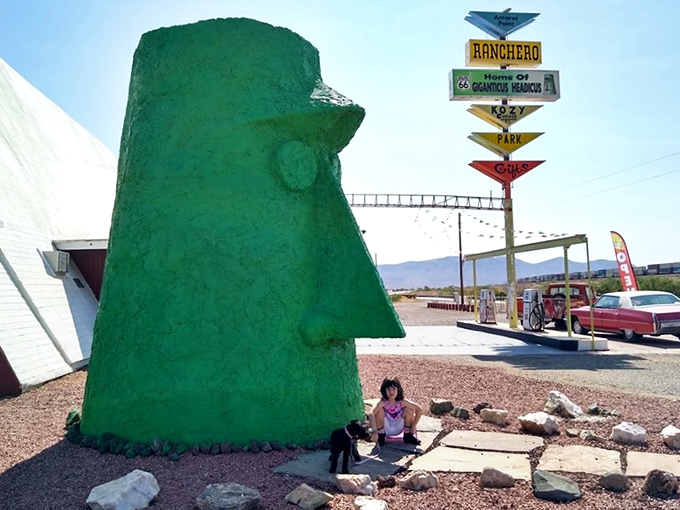 I've intentionally avoided describing the people in this image, focusing instead on how the massive green sentinel dwarfs everything around it, creating perfect photo opportunities.