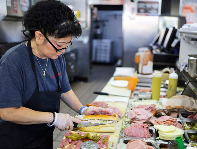 Precision in action – each ingredient placed with the care of a surgeon, because sandwich architecture matters.