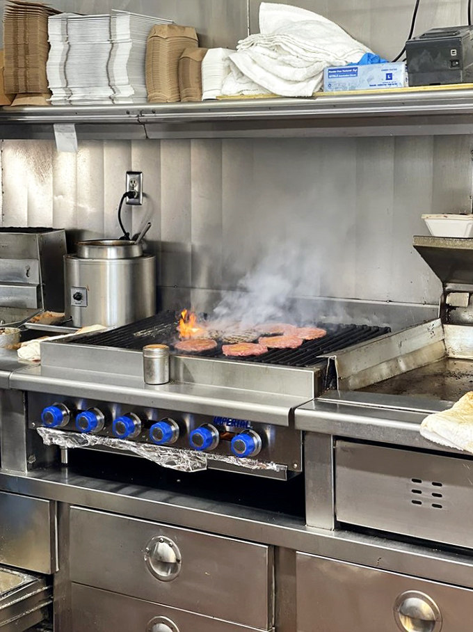 Where the magic happens &ndash; patties sizzling on an open flame in the time-honored tradition that no fancy cooking technique can improve upon.